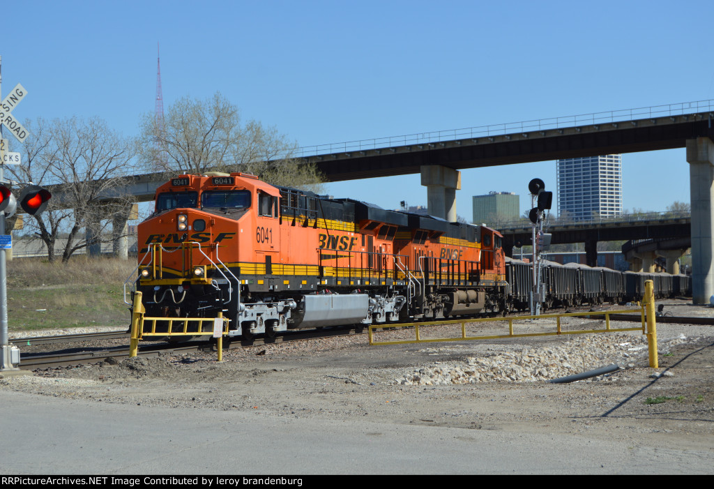BNSF 6041 brings a nb rock train across the ex santa fe interlocker